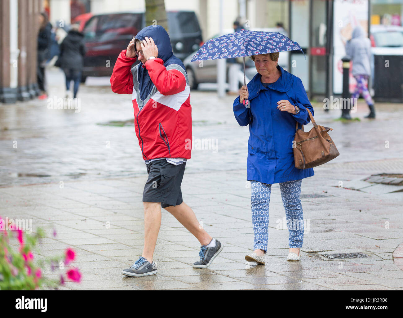 Windy day umbrella hi-res stock photography and images - Alamy