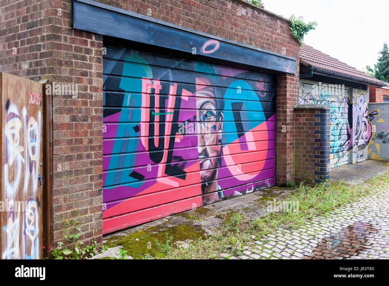 Northampton, Street Art in alleyway on garage doors Stock Photo - Alamy