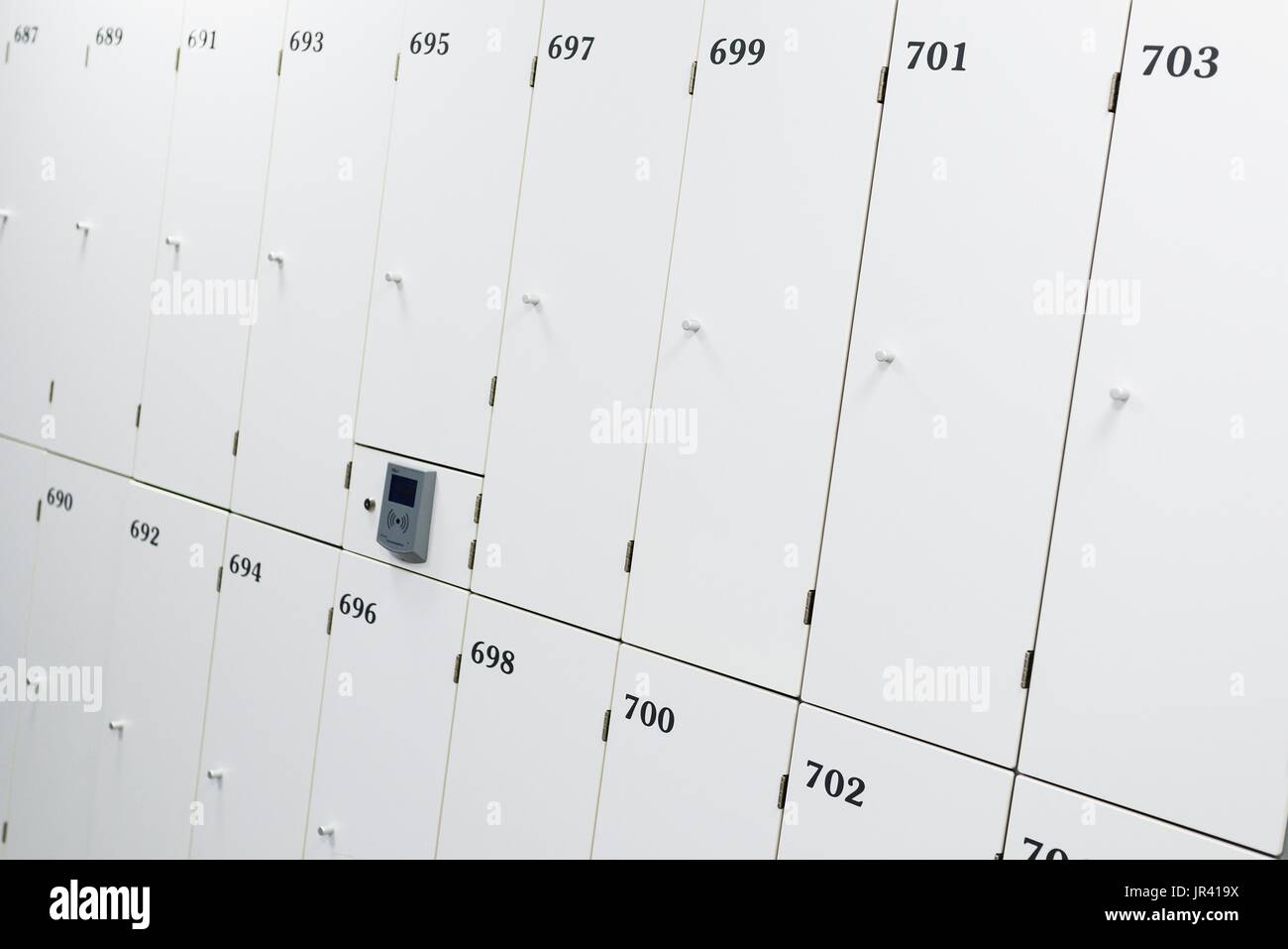 White change room lockers with electronic access control Stock Photo ...