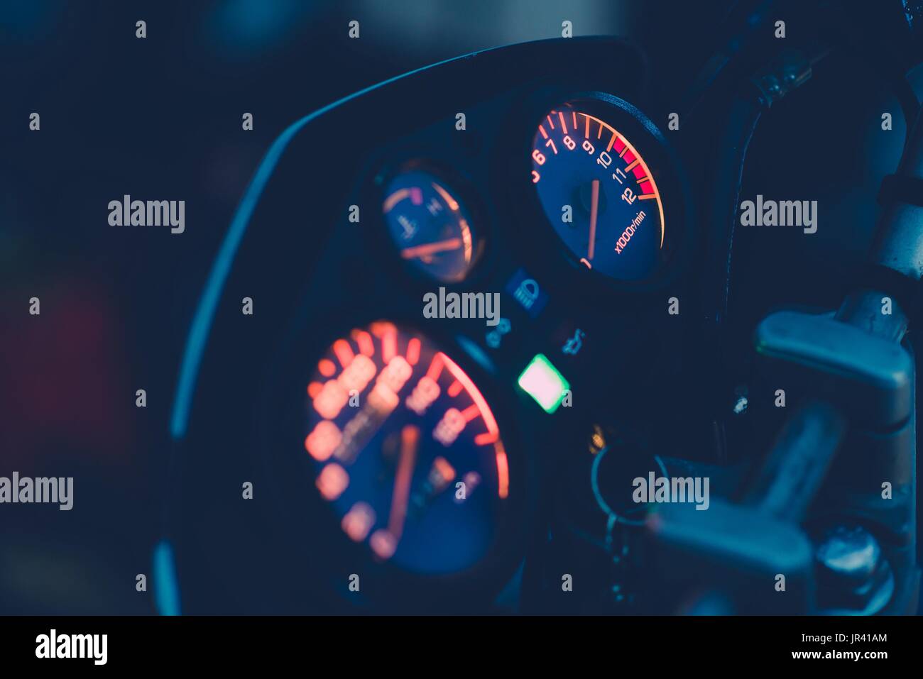 Illuminated motorbike control panel with speedometer and revs counter ...