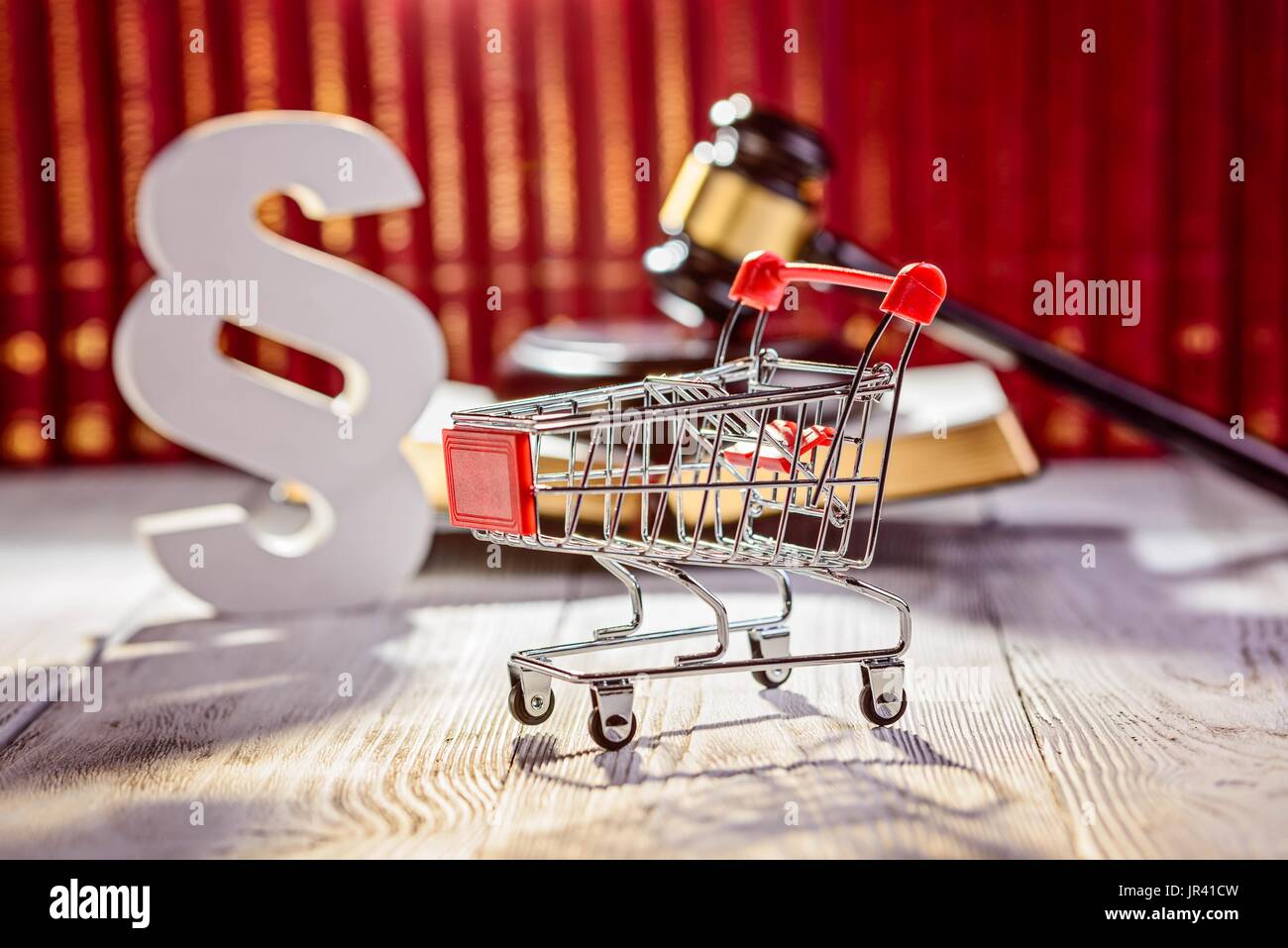 Little trolley - pushcart with the symbols of law in court library with ...