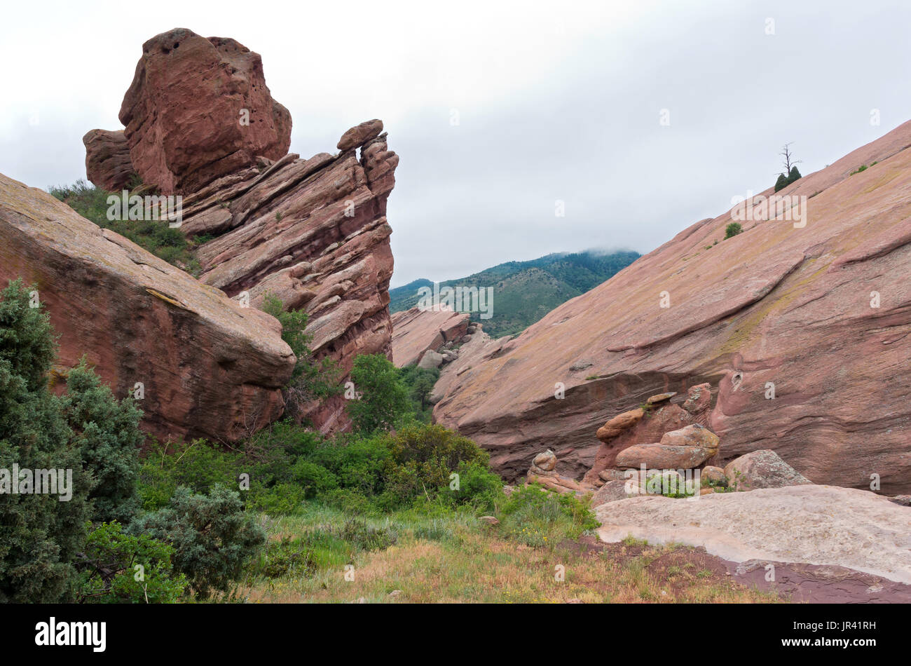 red sandstone rock formations and surrounding mountains of red rocks ...