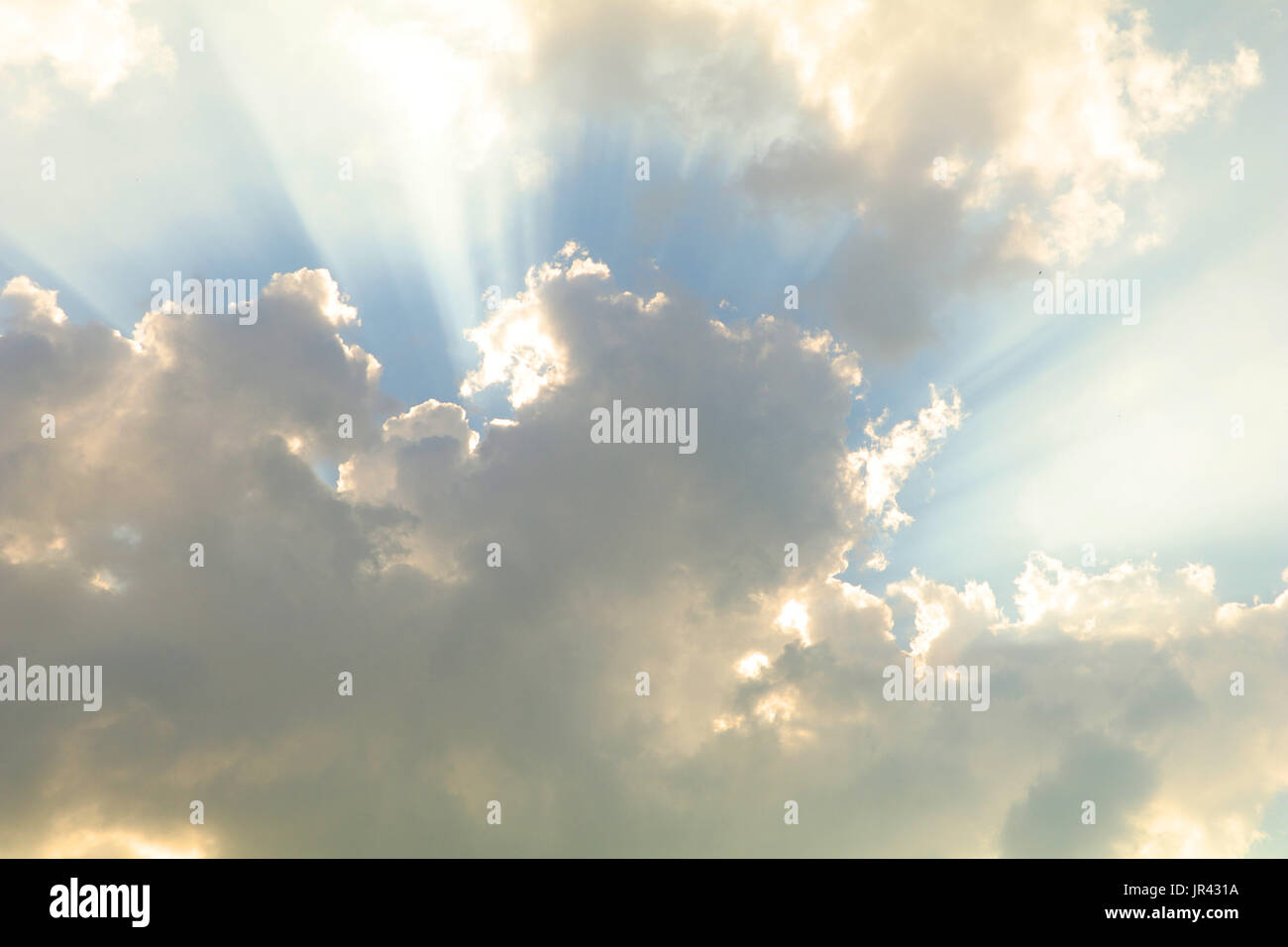 Cloudy sky with hidden suns' powerful rays Stock Photo - Alamy