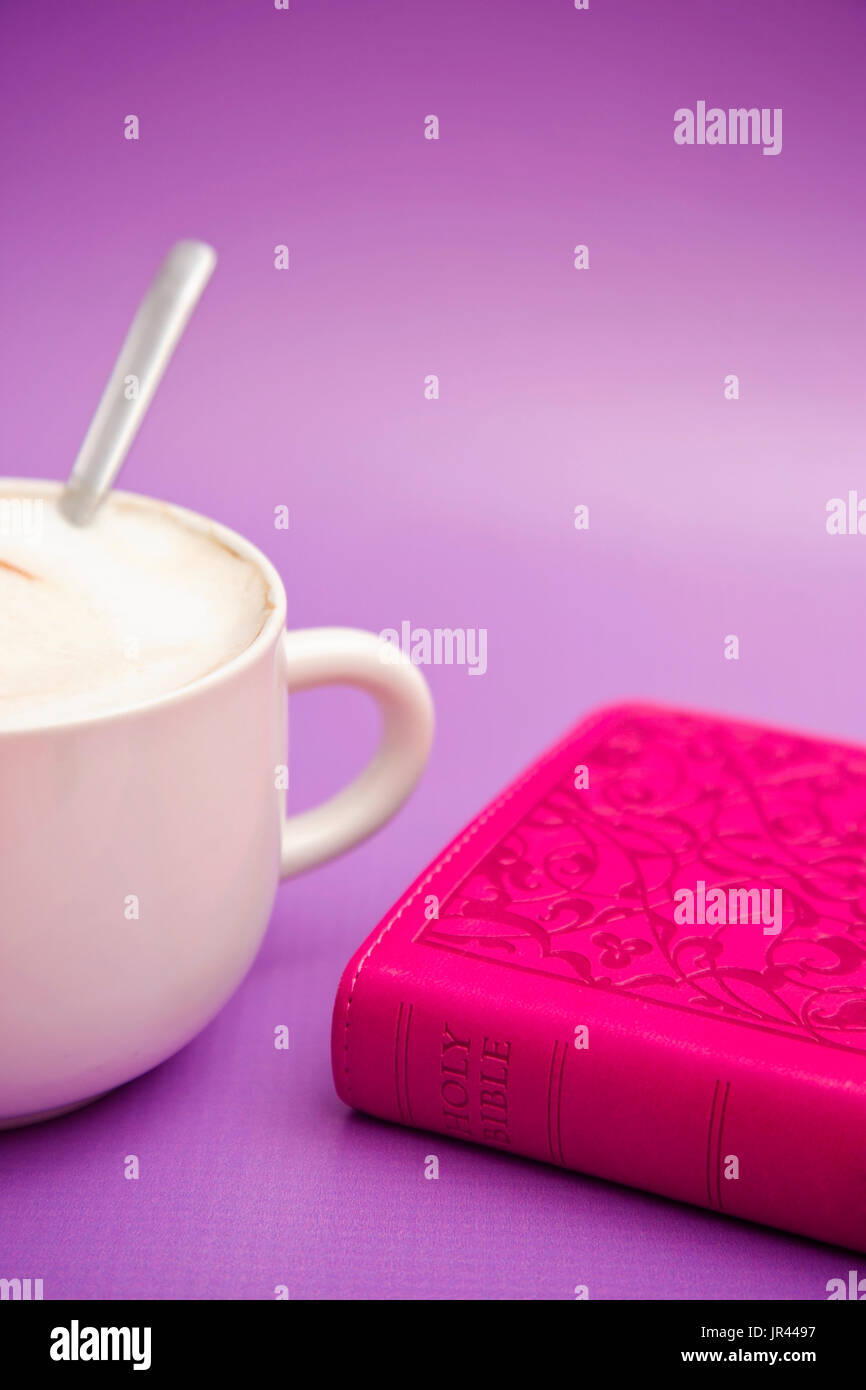 Closed Pink Bible on a Purple Background Stock Photo - Alamy
