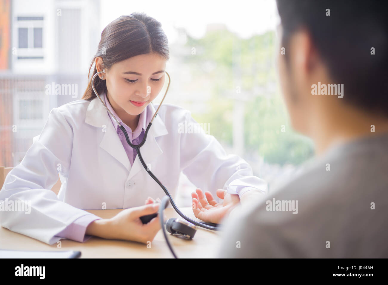 doctor using a stethoscope for examining patient, medical concept Stock ...