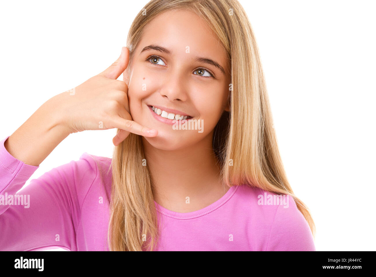 Portrait of lovely young girl taking a call me gesture over white ...