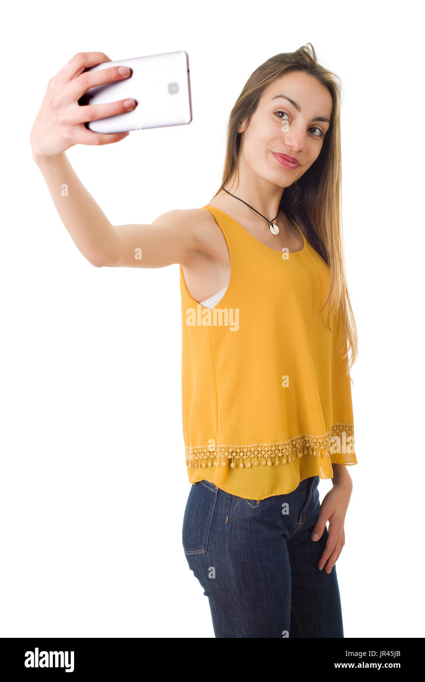 Beautiful woman smiling and taking a selfie, isolated over a white ...