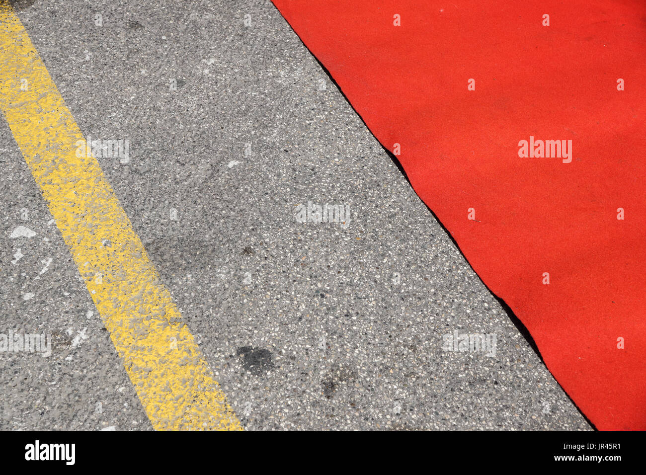 Red carpet entrance detail on asphalt road Stock Photo - Alamy