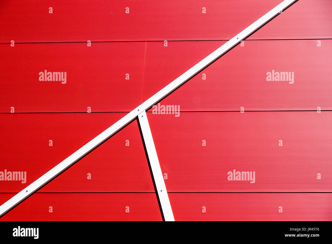 details of aluminum facade with colorful red panels Stock Photo - Alamy