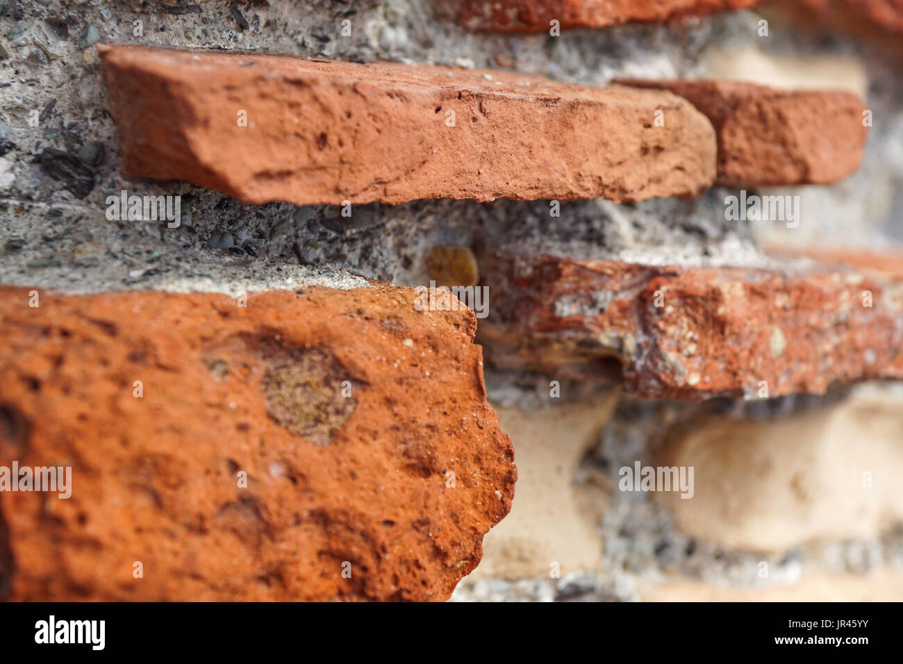 Closeup of Stack of Raw Bricks on the external wall Stock Photo - Alamy