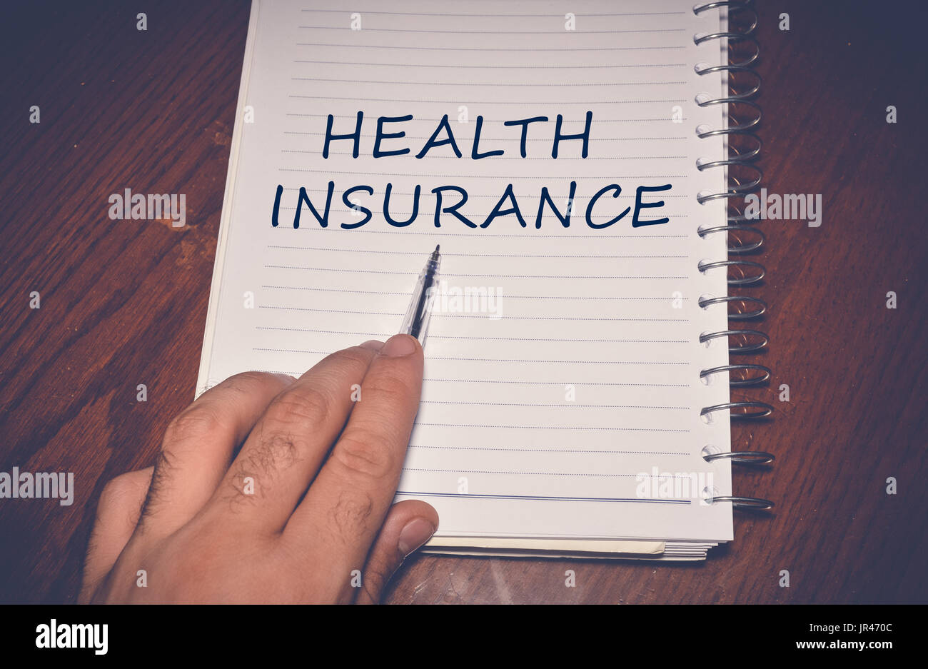 Health Insurance written on white paper Stock Photo - Alamy