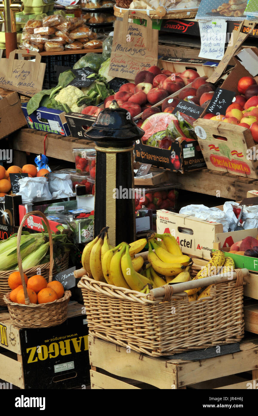 fresh fruit and vegetables dislayed enticingly in the front of a shop ...