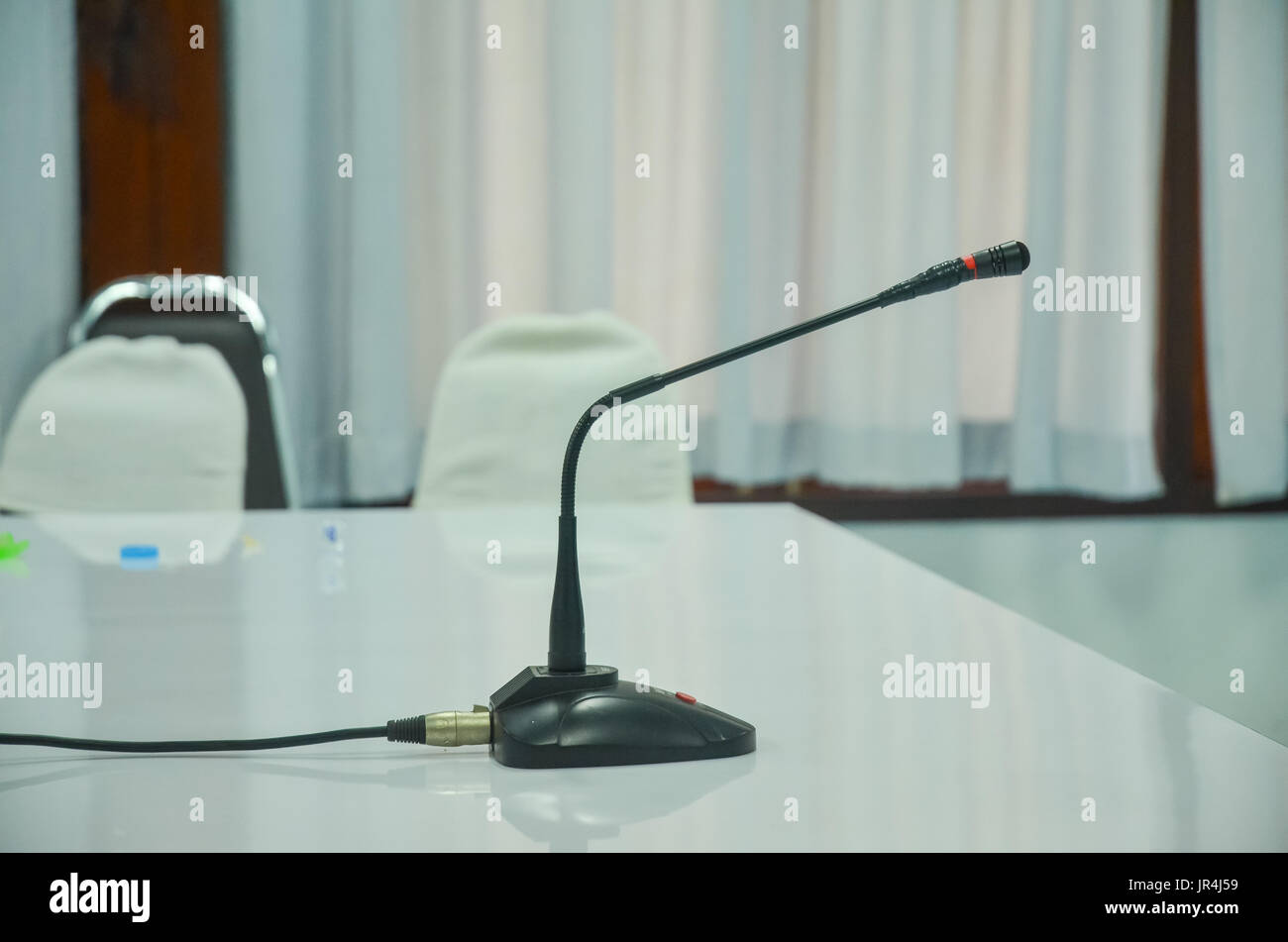 Microphone in a conference room on table Stock Photo - Alamy