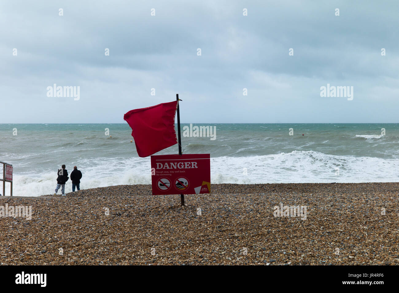 Red warning sign beach england hi-res stock photography and images - Alamy