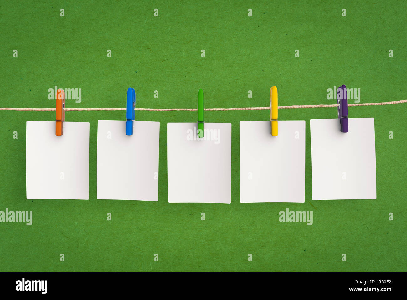 five blank papers hanging with cloth pegs Stock Photo - Alamy