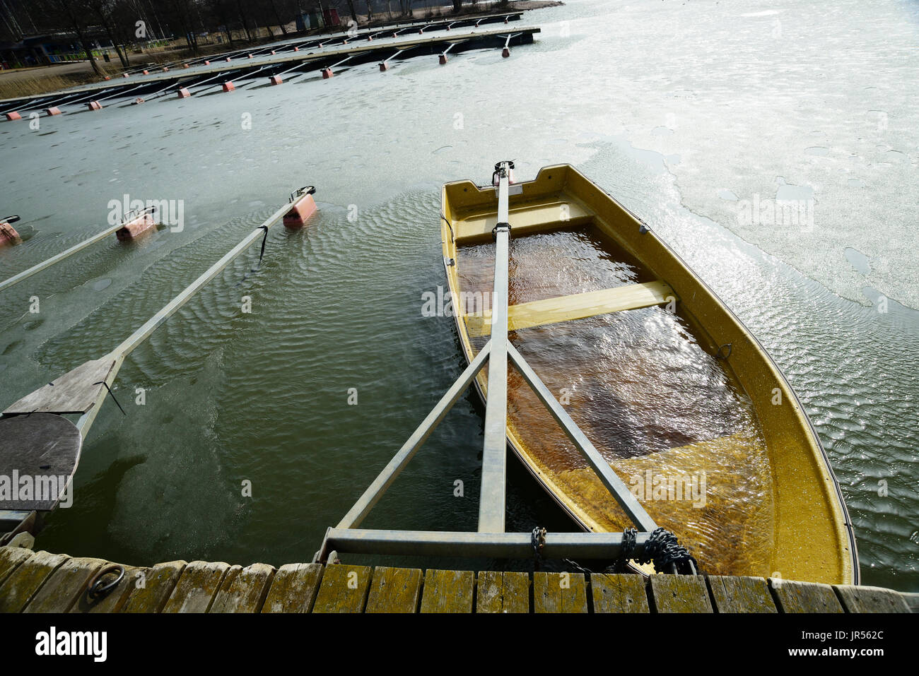 a boat flooded with water at the pier in Finland Stock Photo - Alamy