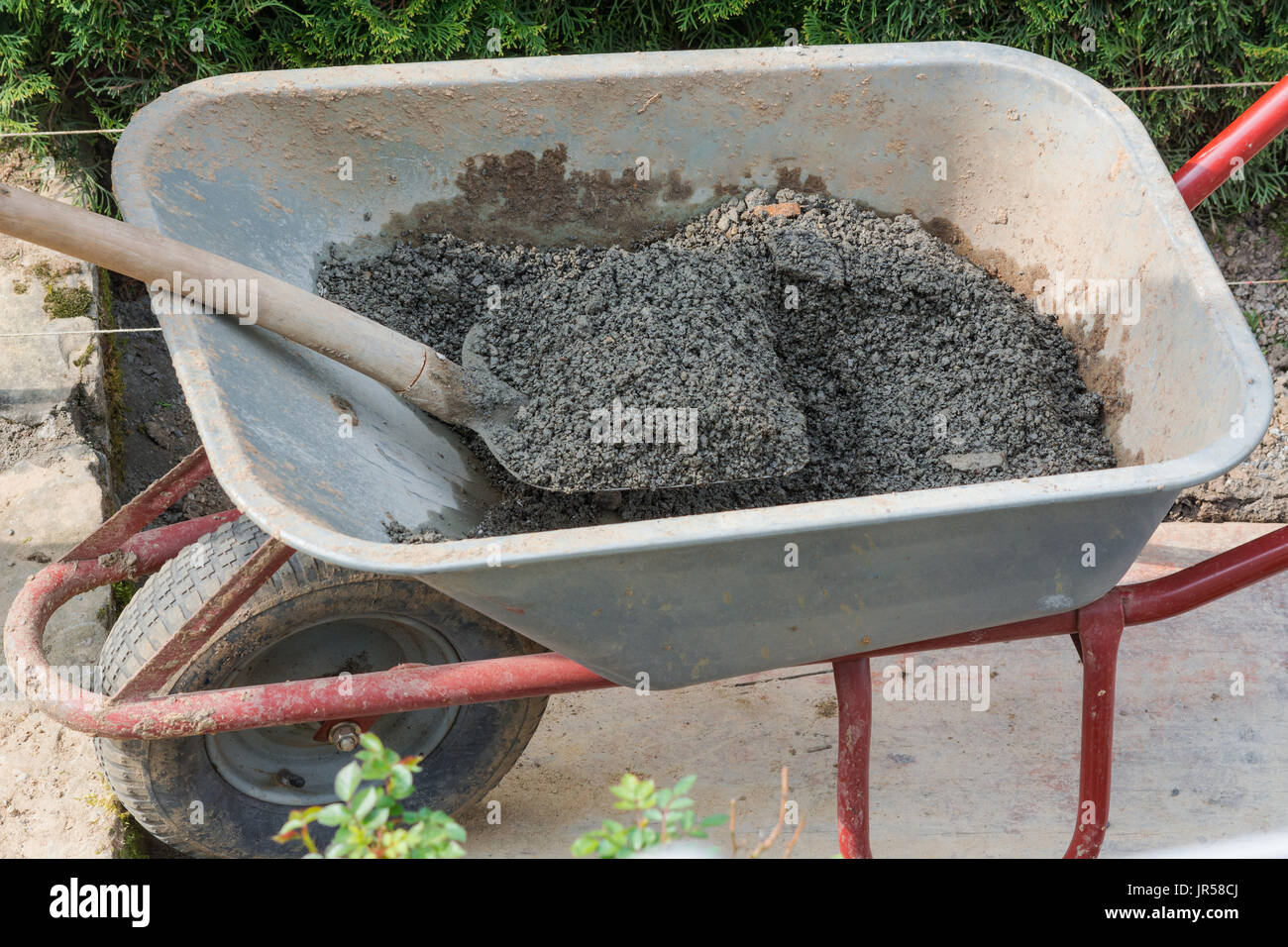 Wheelbarrow on road construction site hi-res stock photography and ...