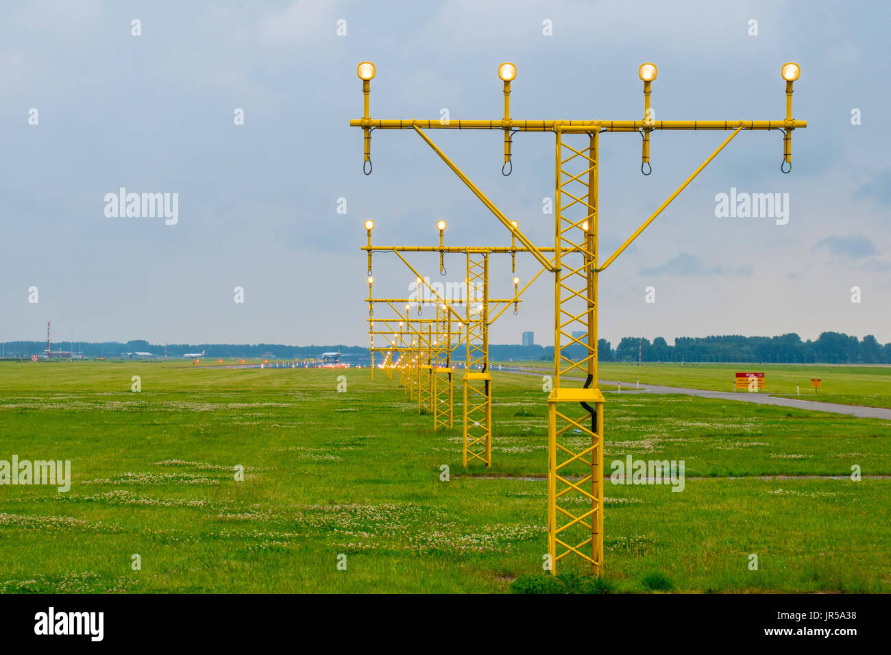 The guiding lights to the runway of an airport Stock Photo - Alamy