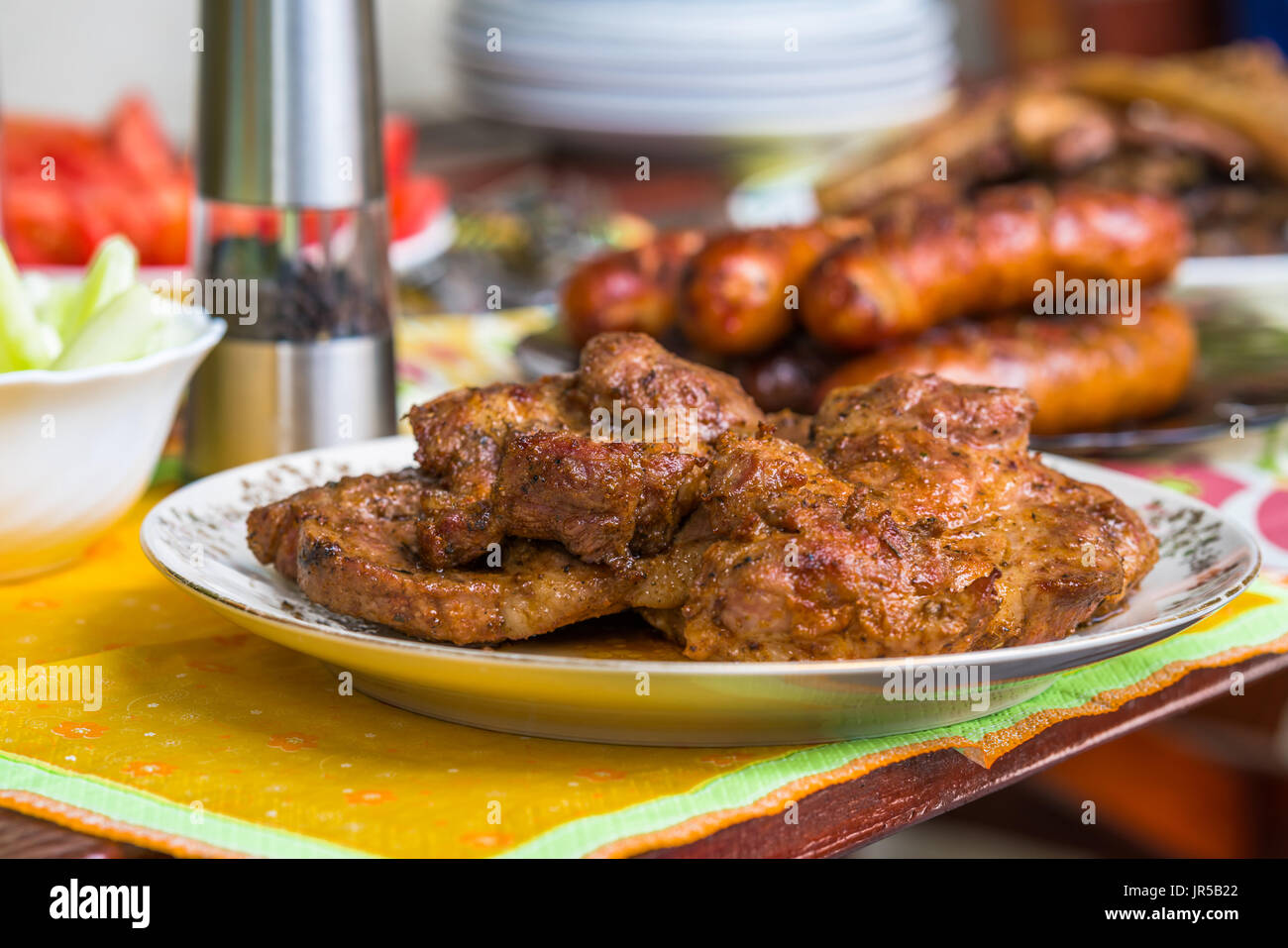 Grilled BBQ meat set on garden table - selective focus Stock Photo - Alamy