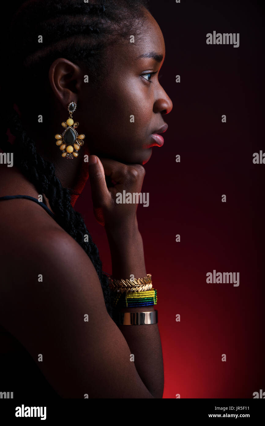 Colorful and creative side view portrait of african woman with dark ...