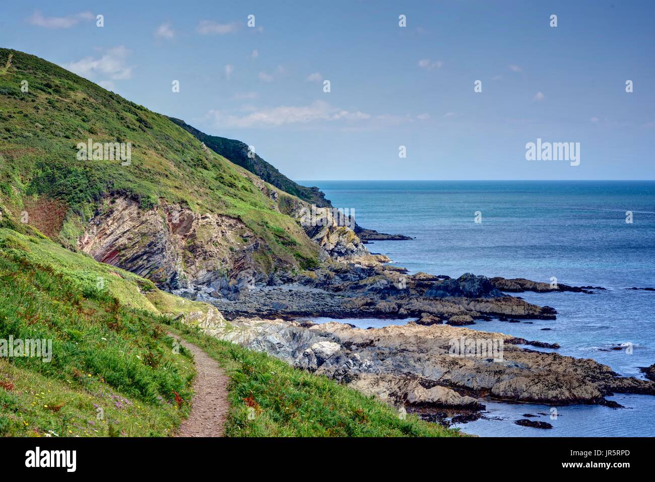 A beautiful picturesque landscape of Cornish coastline with azure blue ...