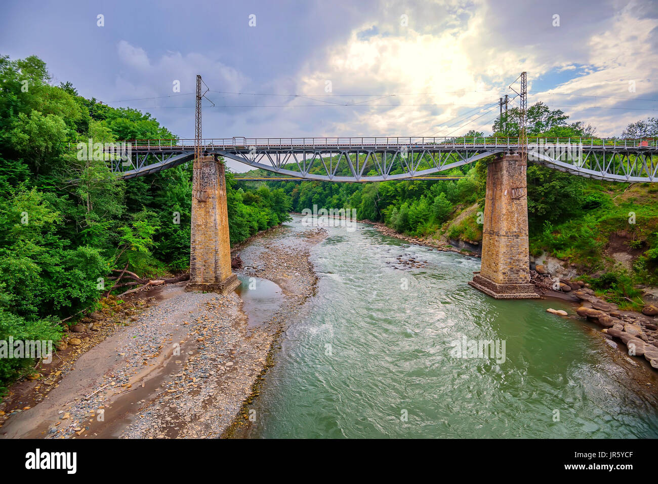 Railroad bridge in summer landscape of mountain forest Stock Photo - Alamy