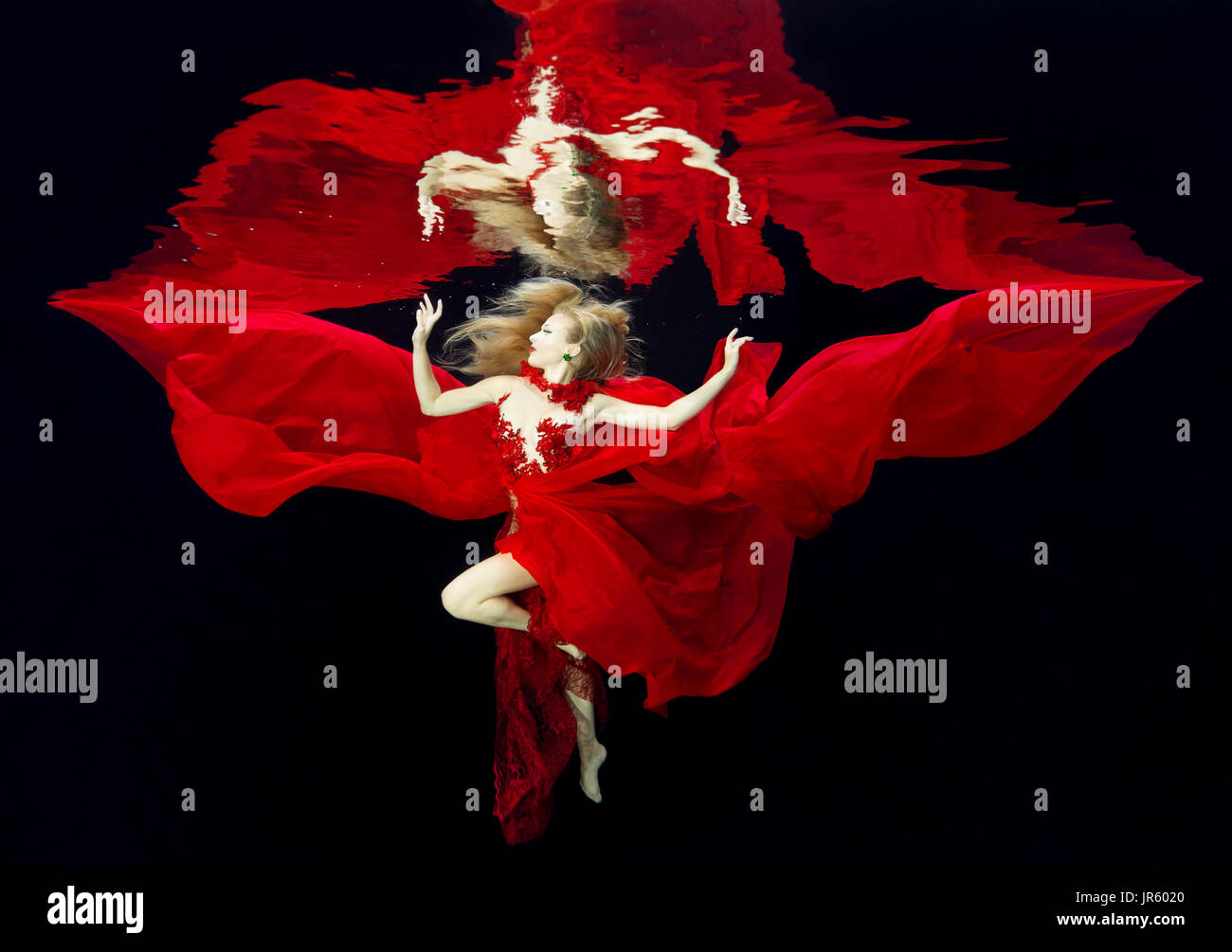 Woman in flowing black dress hi-res stock photography and images - Alamy