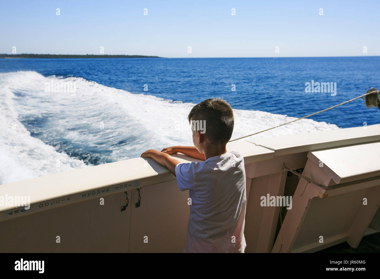 boy seeing the sea on a boat Stock Photo - Alamy