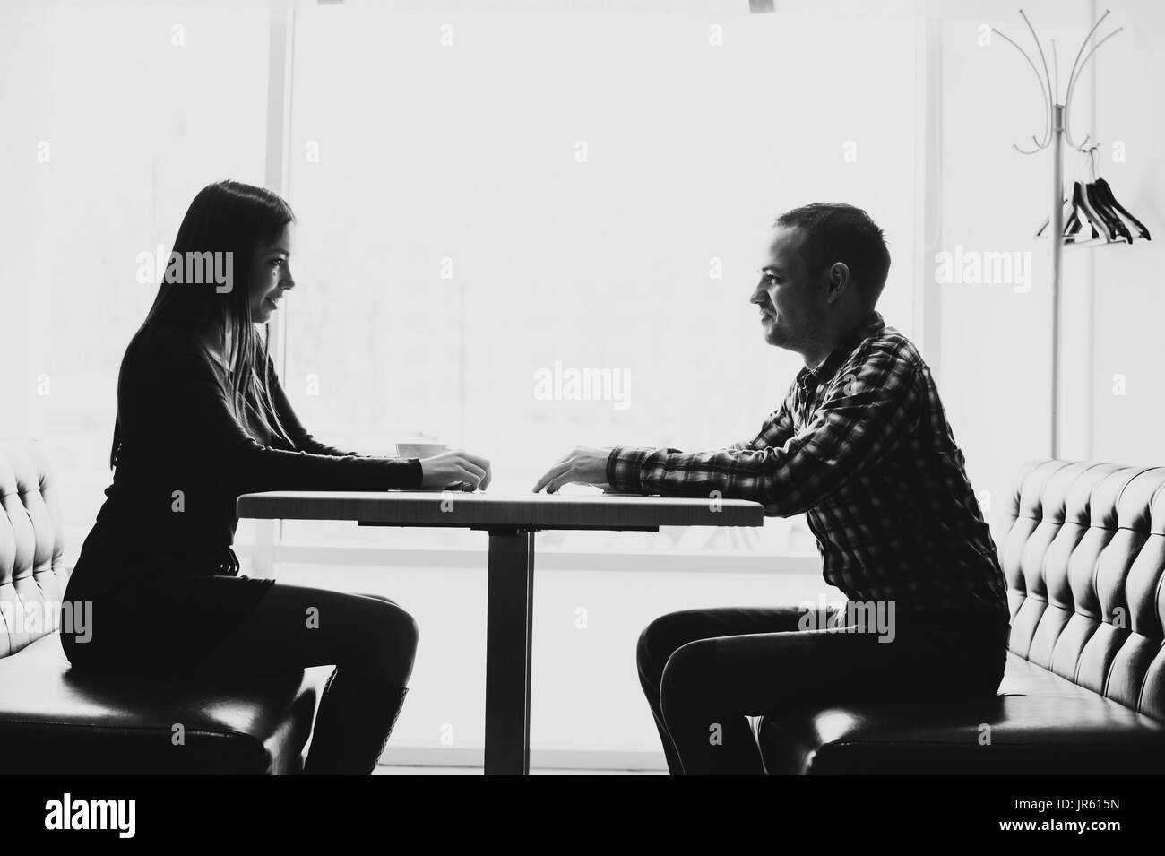 Man and woman in discussions in the restaurant Stock Photo - Alamy
