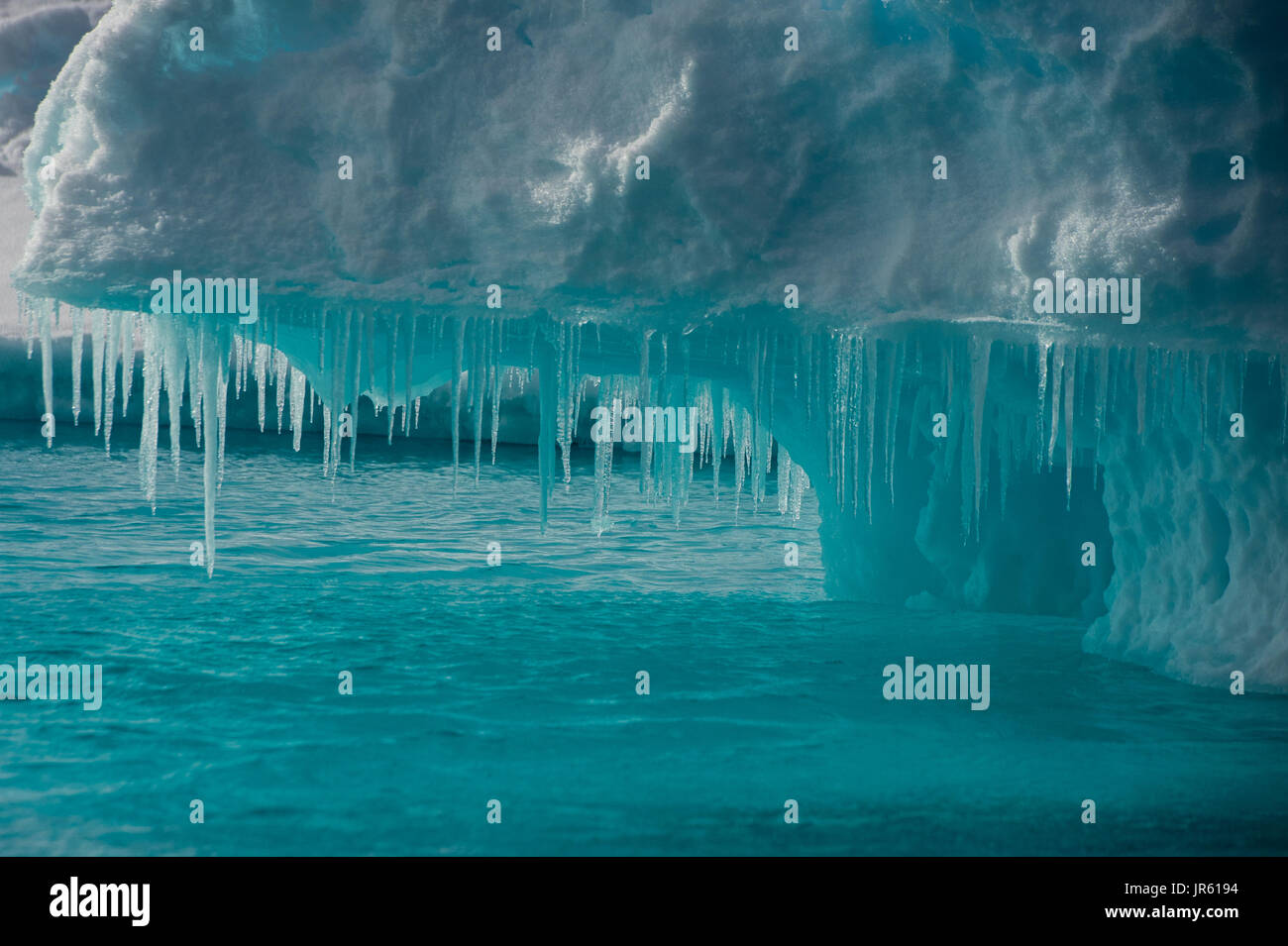 Icicles in an iceberg floating in the Arctic Ocean, by the north coast ...
