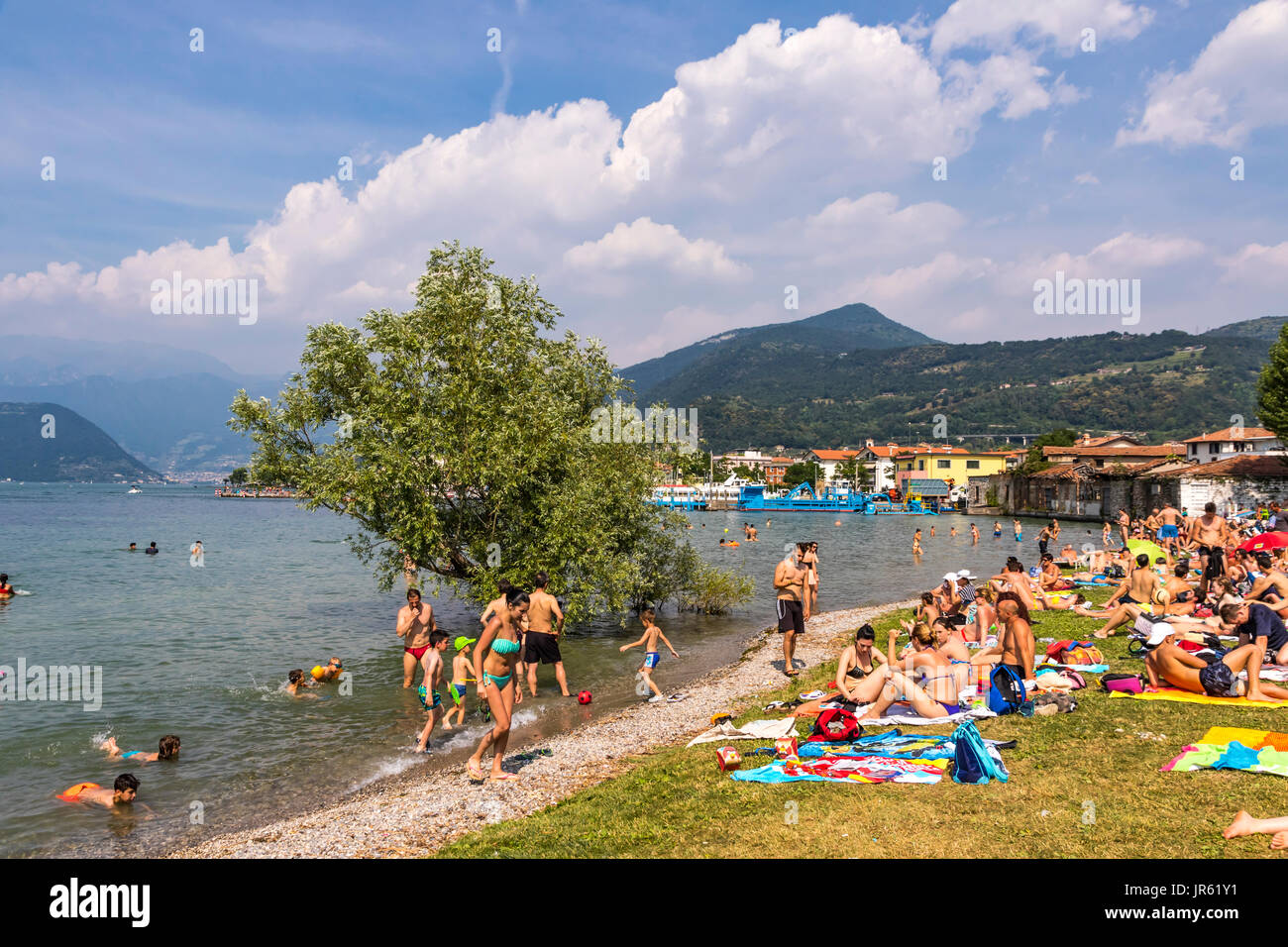 ISEO, ITALY - JUNE 17, 2017: Crowded summer beach on Iseo lake, Iseo ...