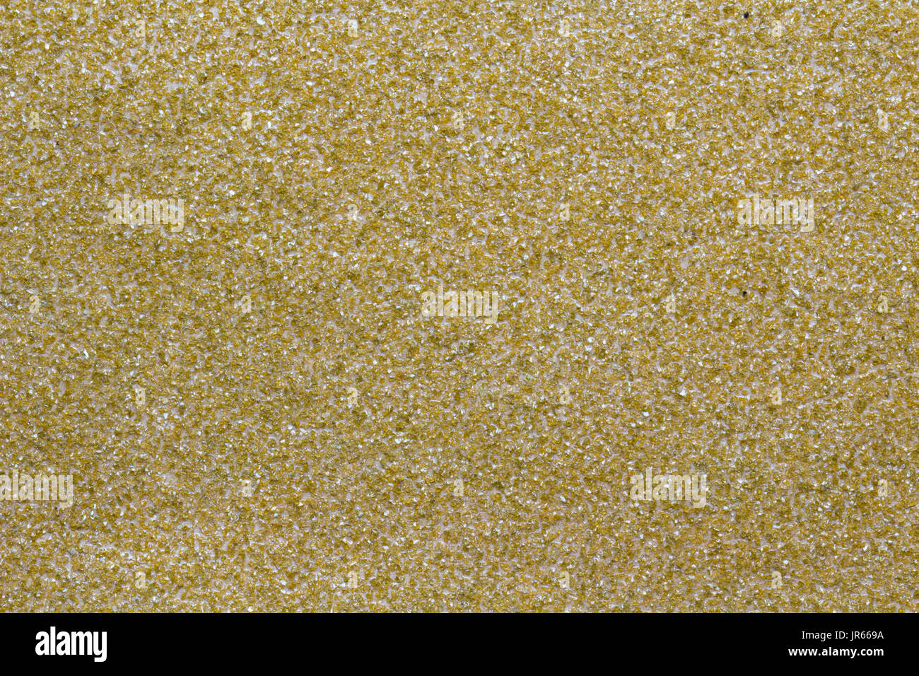 Closeup image showing the texture of a coarse yellow sandpaper Stock ...