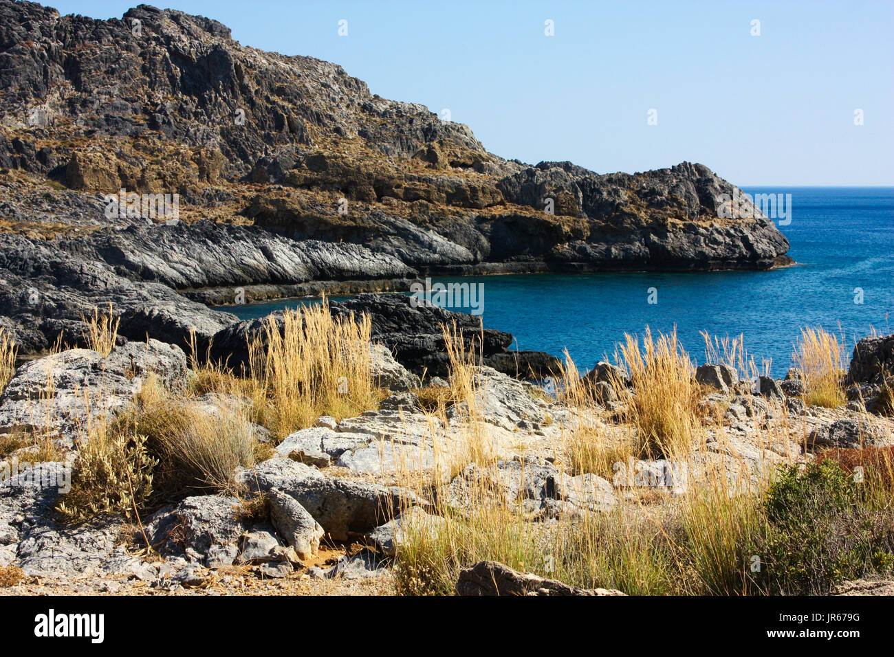 Cretan sea wild coastline and countryside with a blue sky Stock Photo ...