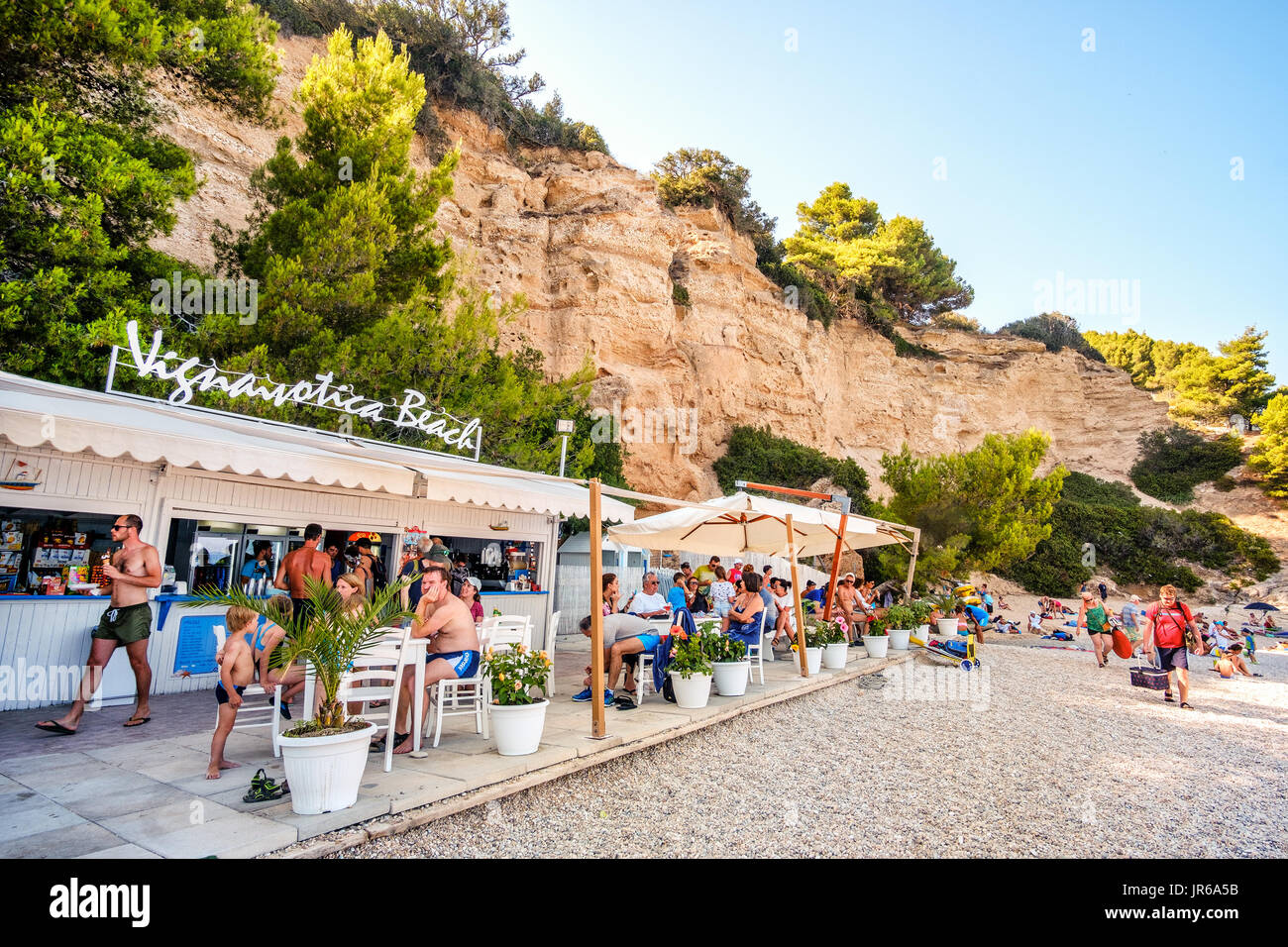 Gargano, Italy, 20 Jul 2017: Vignanotica beach bar, tourists in the ...