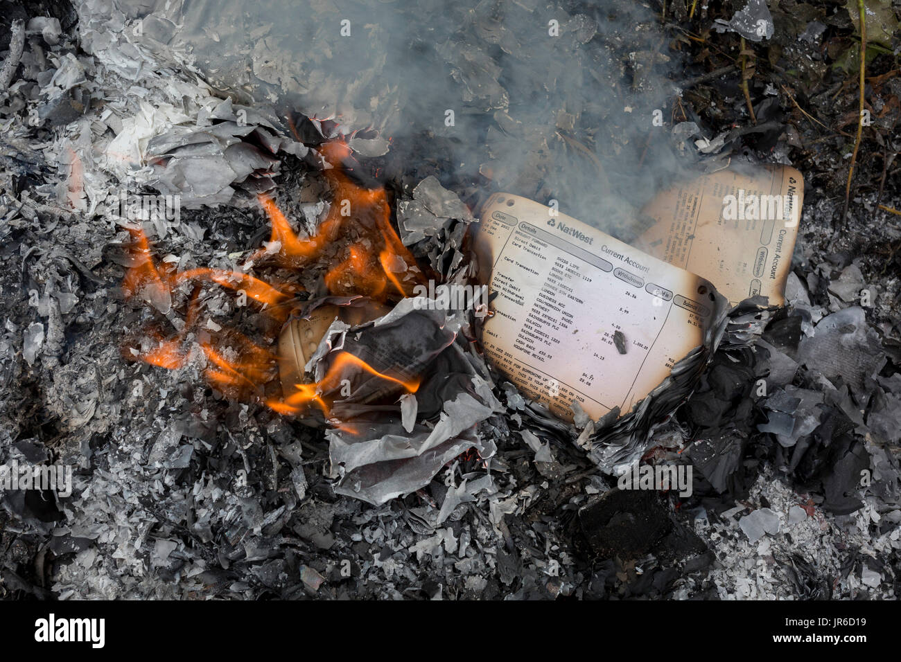 The burning on a bonfire of confidential personal data, accounts ...