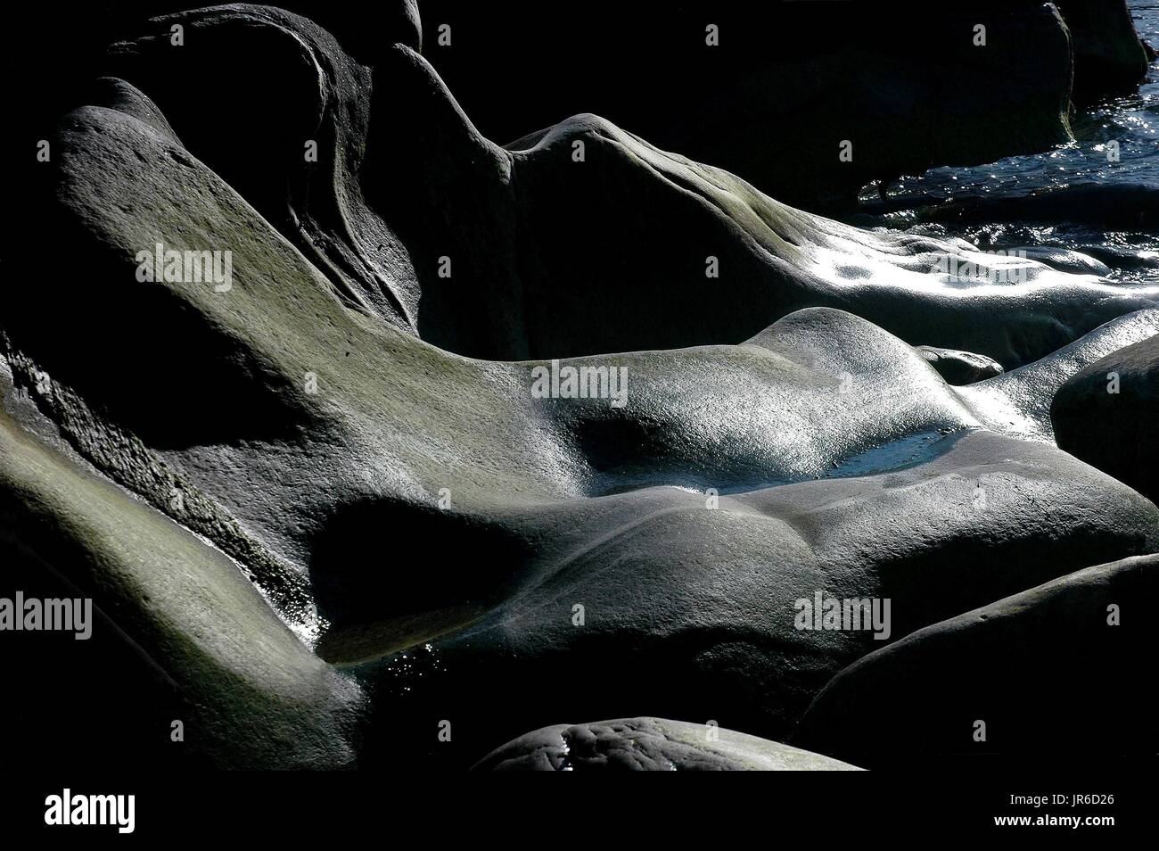 Close-up of smooth rock formations on beach Stock Photo - Alamy