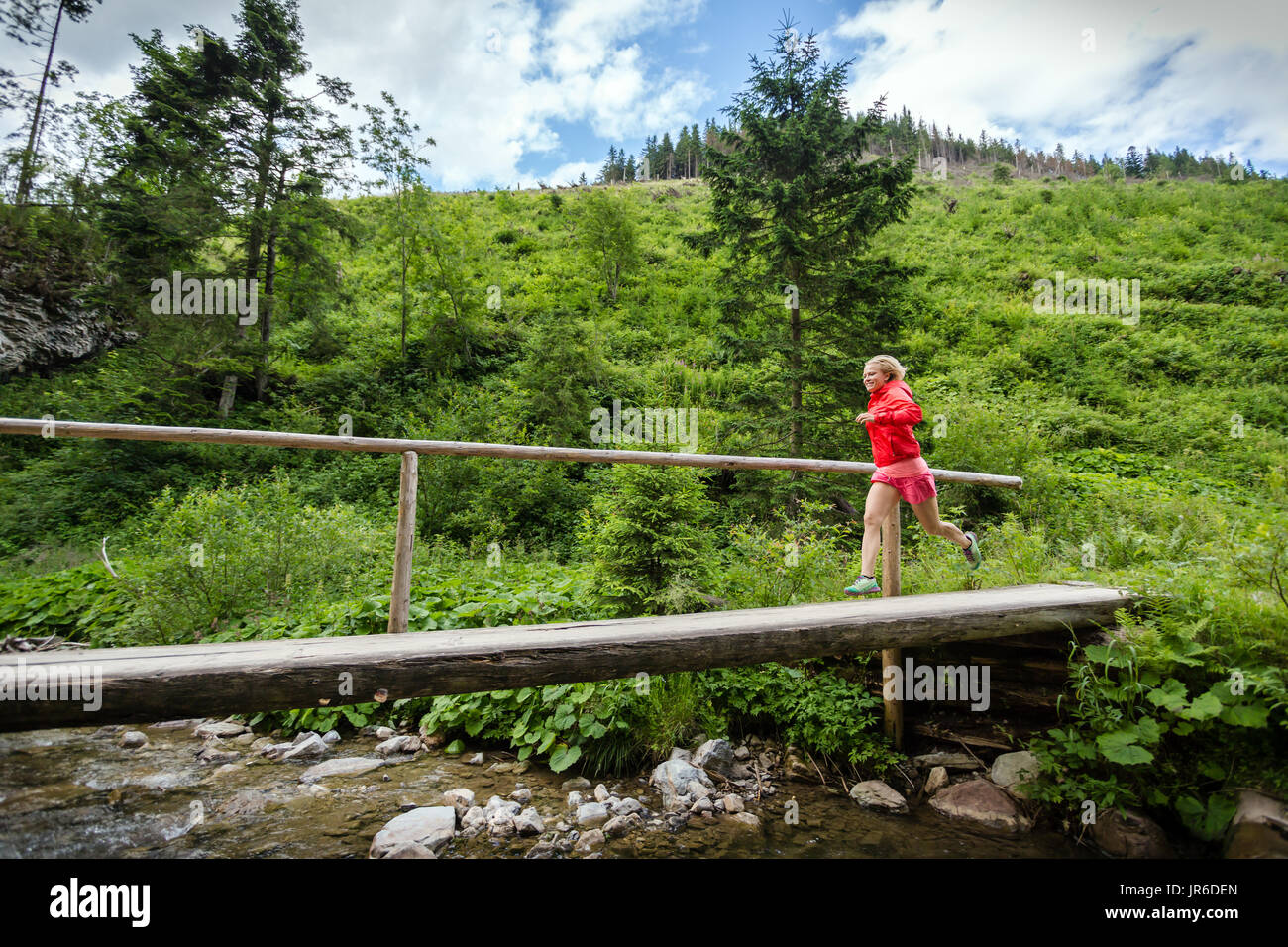 Female running landscape hi-res stock photography and images - Alamy