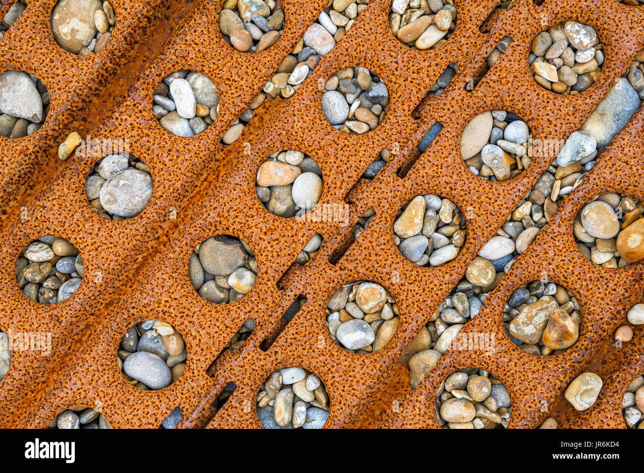Rusting steel tempory roadway laid on a shingle beach Stock Photo - Alamy