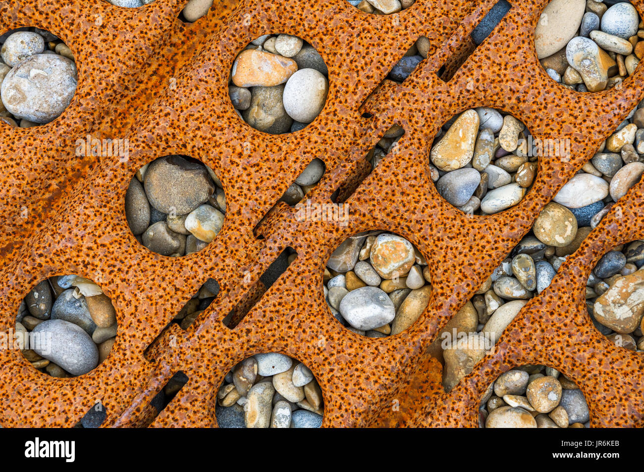 Rusting steel tempory roadway laid on a shingle beach Stock Photo - Alamy