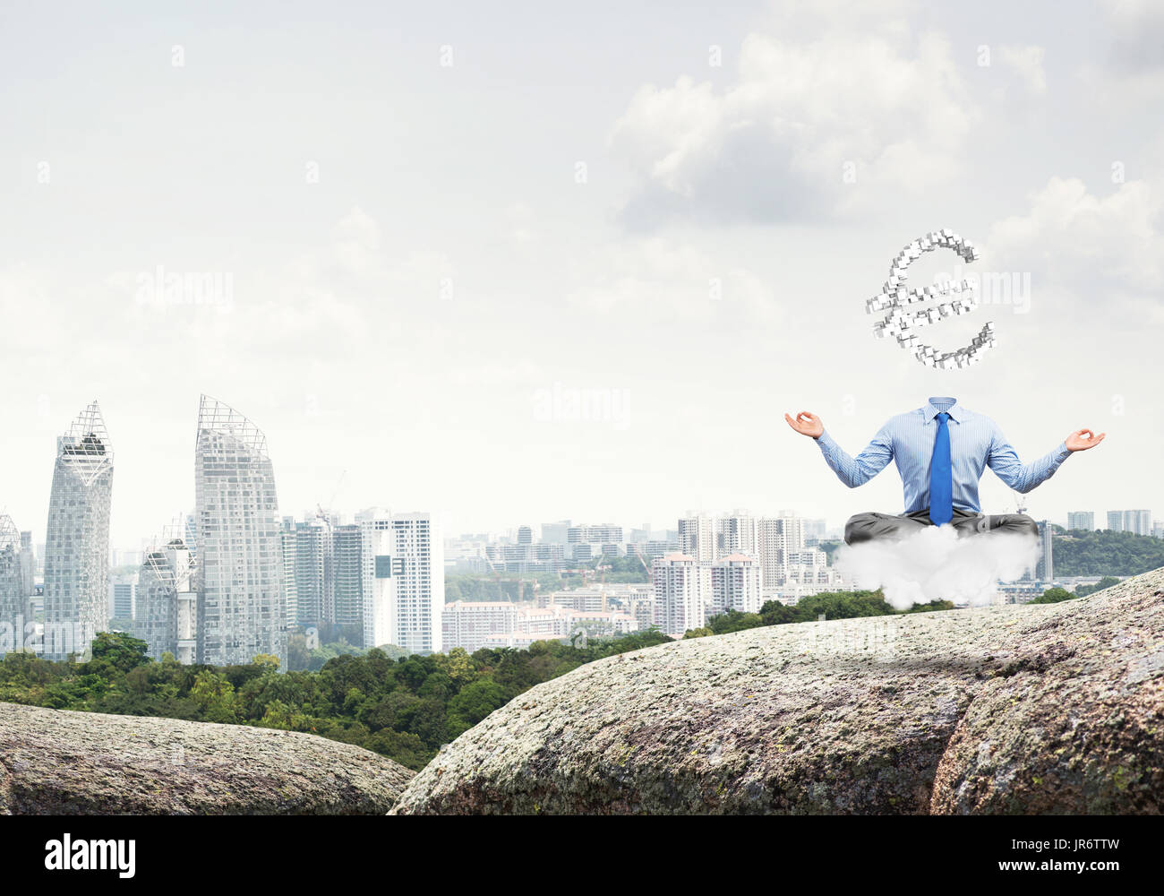 Headless meditating businessman Stock Photo - Alamy
