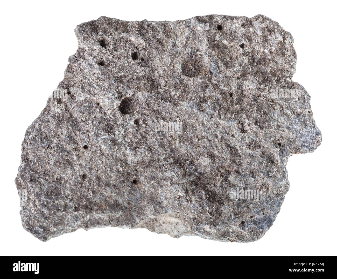 macro shooting of specimen of natural igneous rock - piece of porous basalt stone isolated on ...