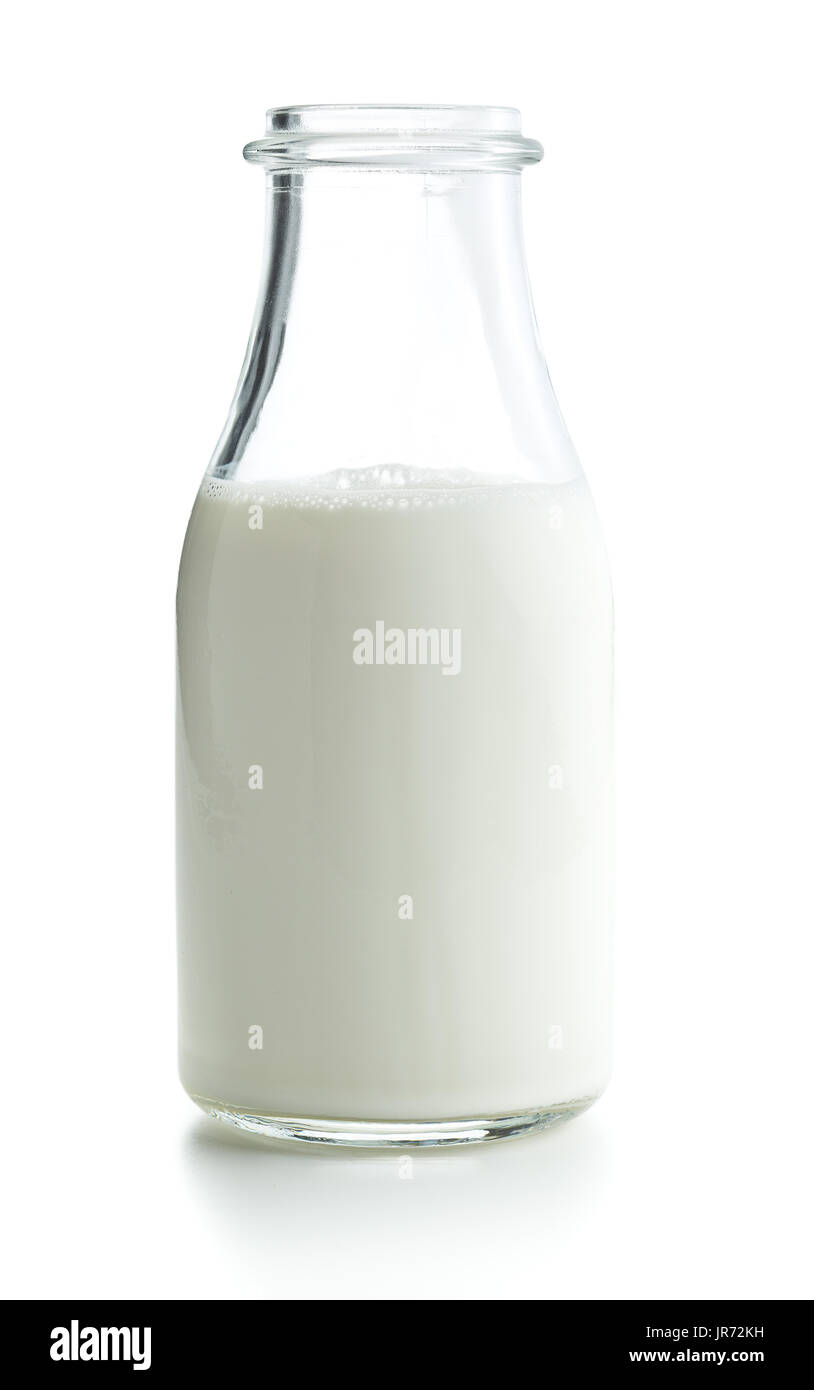 Opened bottle with milk isolated on white background Stock Photo - Alamy