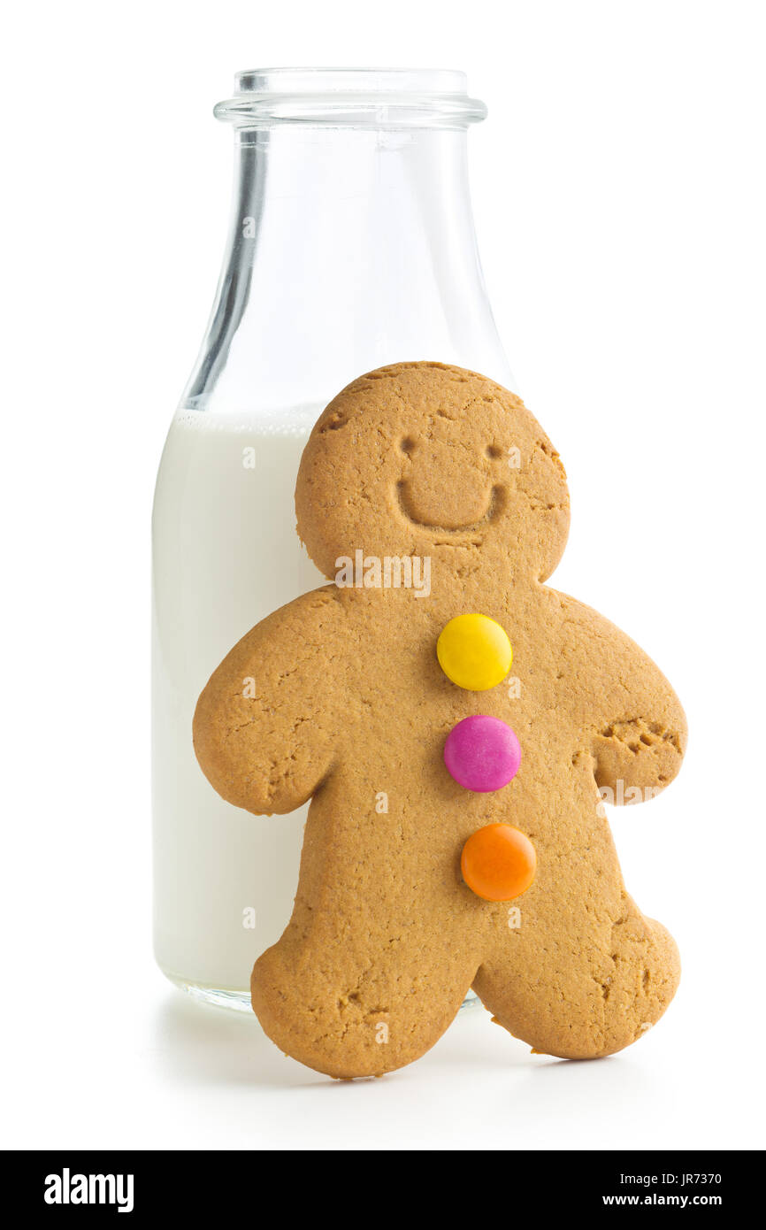 Sweet gingerbread man and milk bottle isolated on white background ...