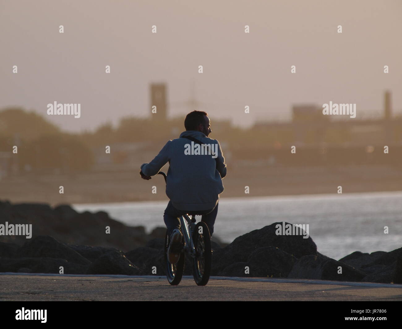 Cyclist in windy weather hi-res stock photography and images - Alamy