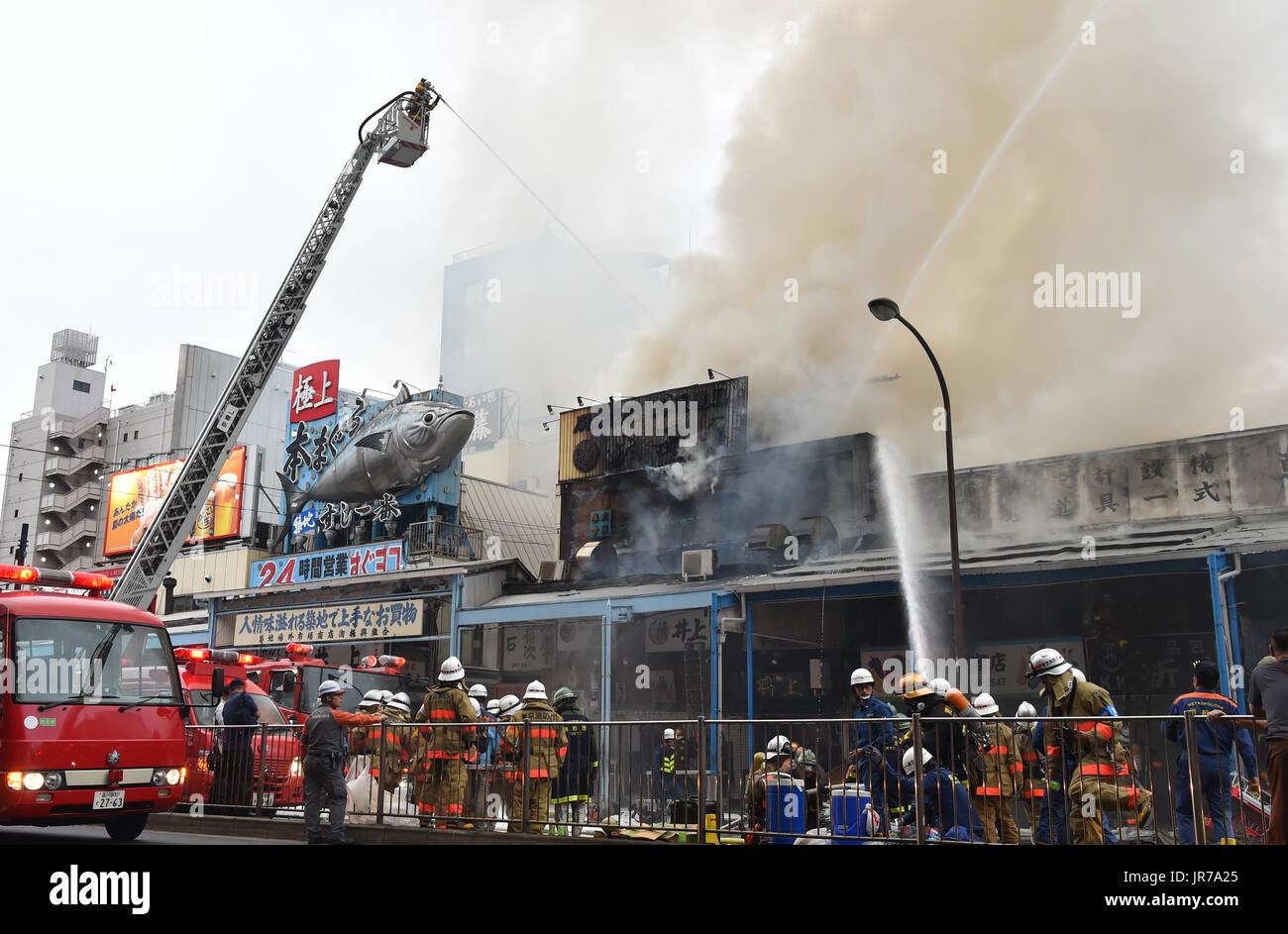 Tokyo, Japan. 3rd Aug, 2017. Firefighters battle a blaze after a fire ...