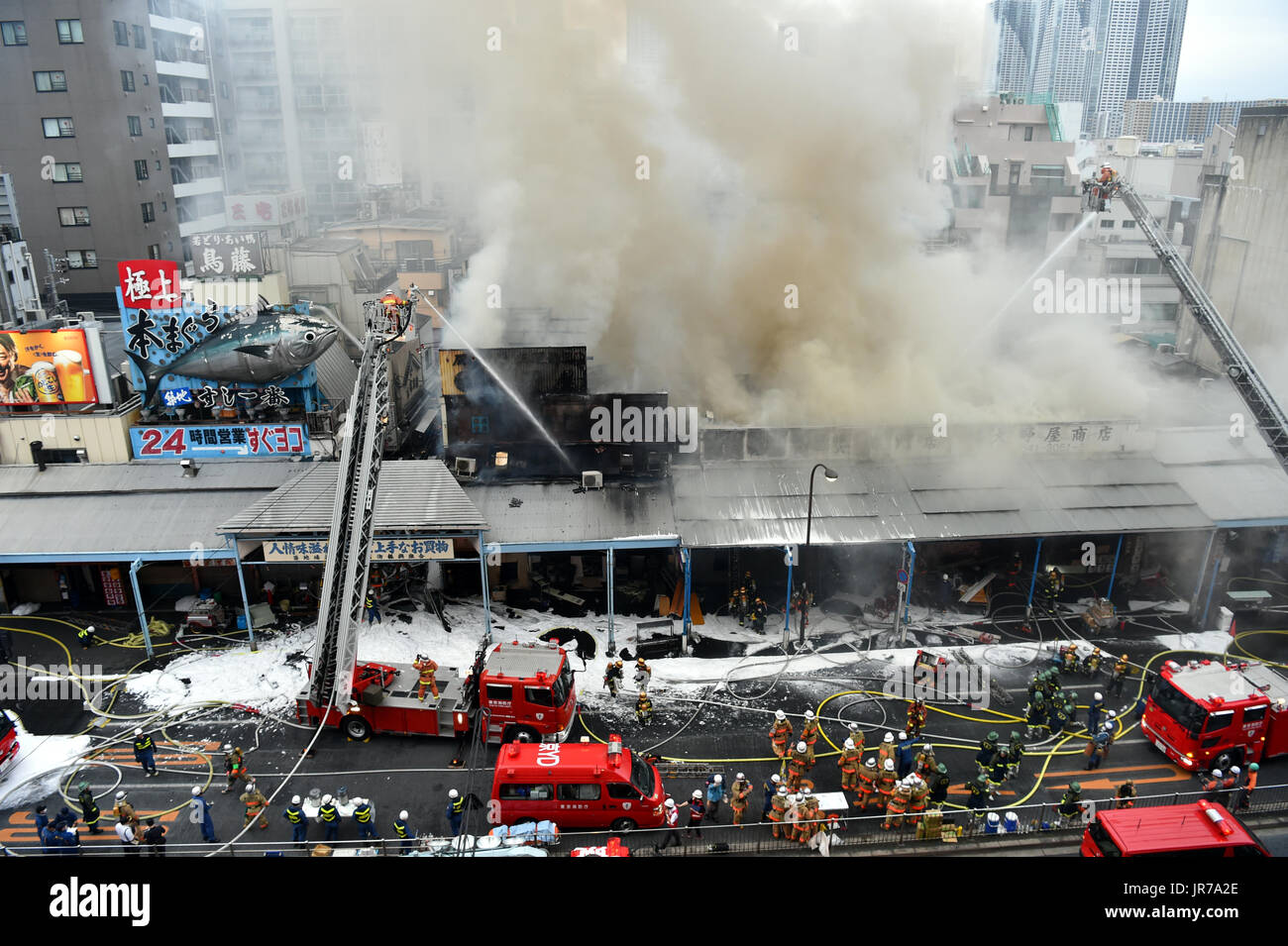 Tokyo, Japan. 3rd Aug, 2017. Firefighters battle a blaze after a fire ...
