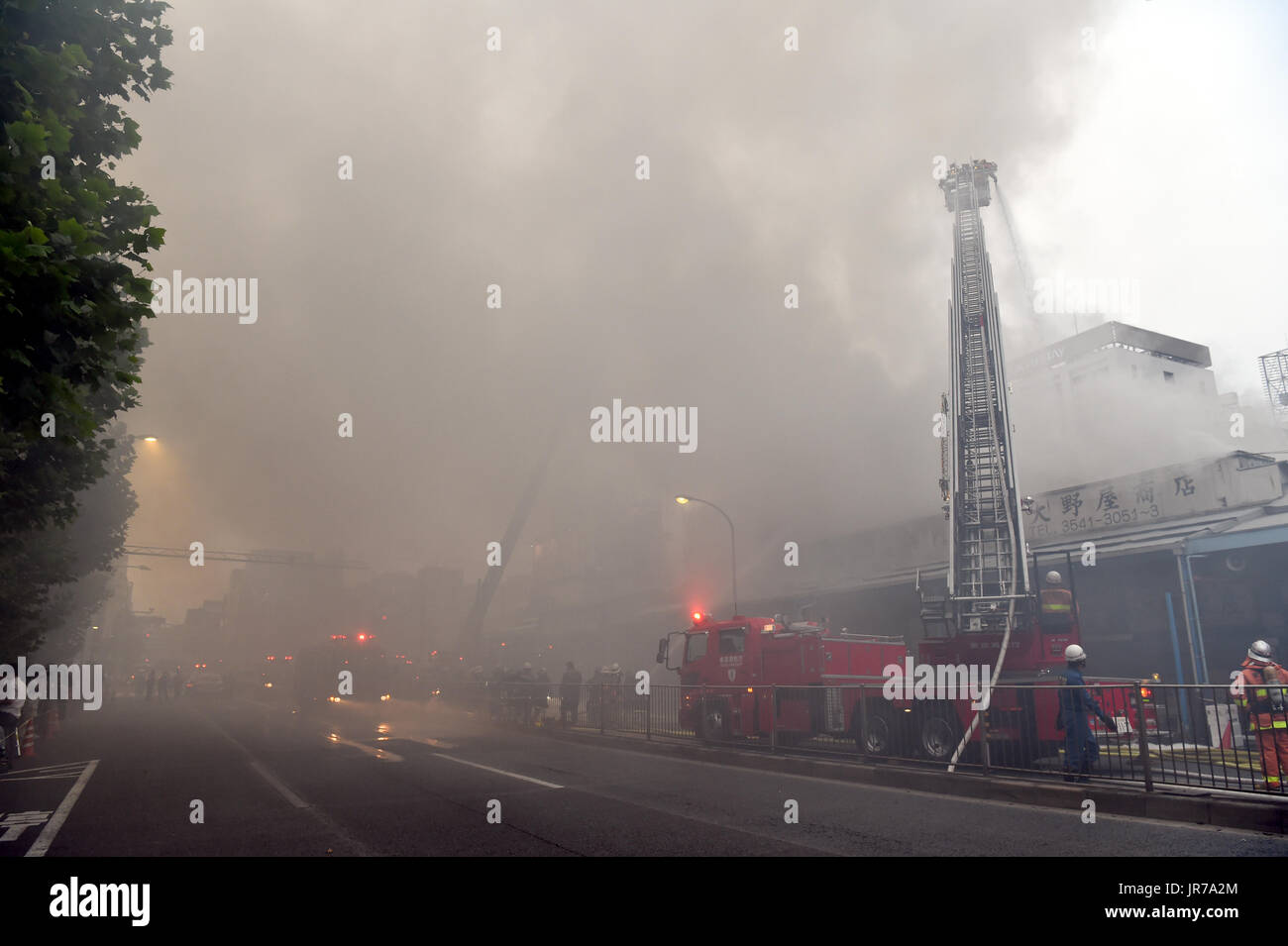 Tokyo, Japan. 3rd Aug, 2017. Firefighters battle a blaze after a fire ...
