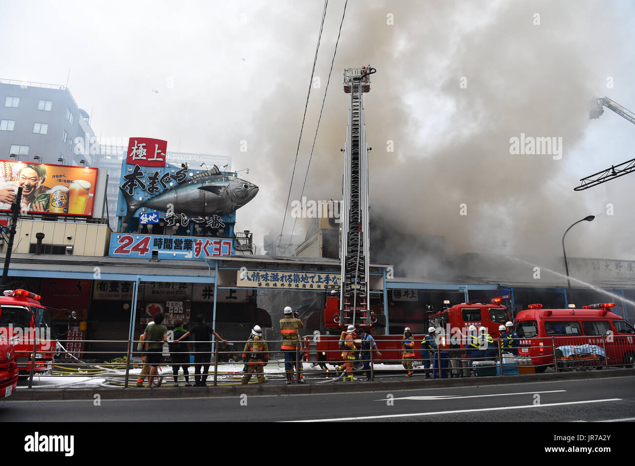 Tokyo, Japan. 3rd Aug, 2017. Firefighters battle a blaze after a fire ...