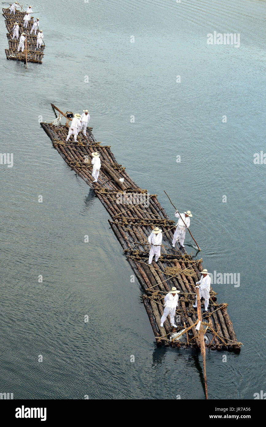 Log rafts A demonstration of timber rafting is under way on the Namhan ...