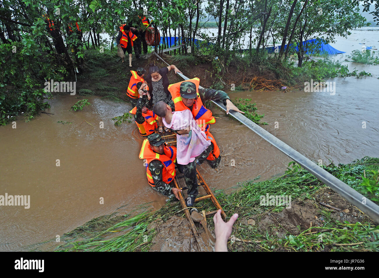 Xiuyan, China's Liaoning Province. 4th Aug, 2017. Firefighters rescue ...